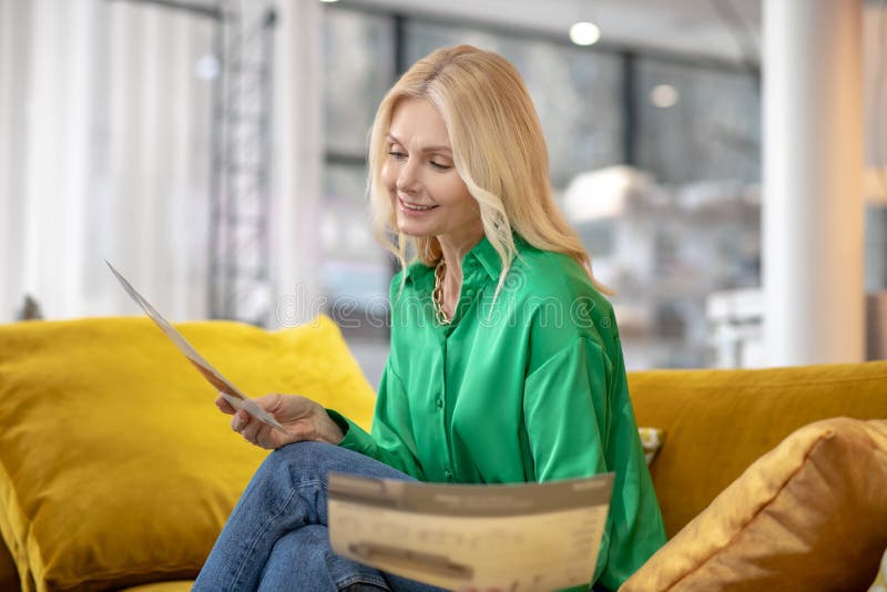 Blonde Woman in a Green Blouse Feeling Interested Stock Photo - Image ...