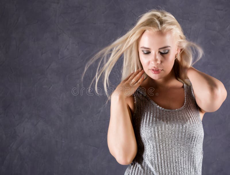 Blonde Woman With Hair In The Wind Girl With Flying Hair On A Gray