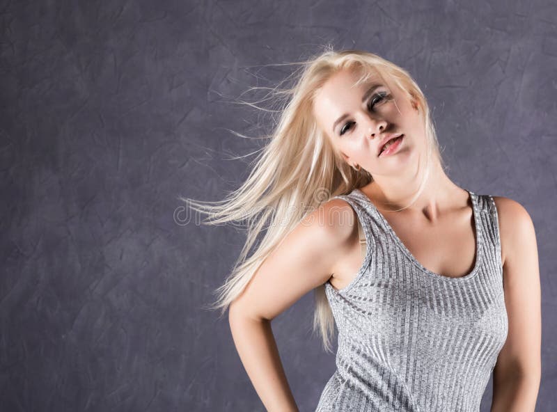 Blonde Woman With Hair In The Wind Girl With Flying Hair On A Gray