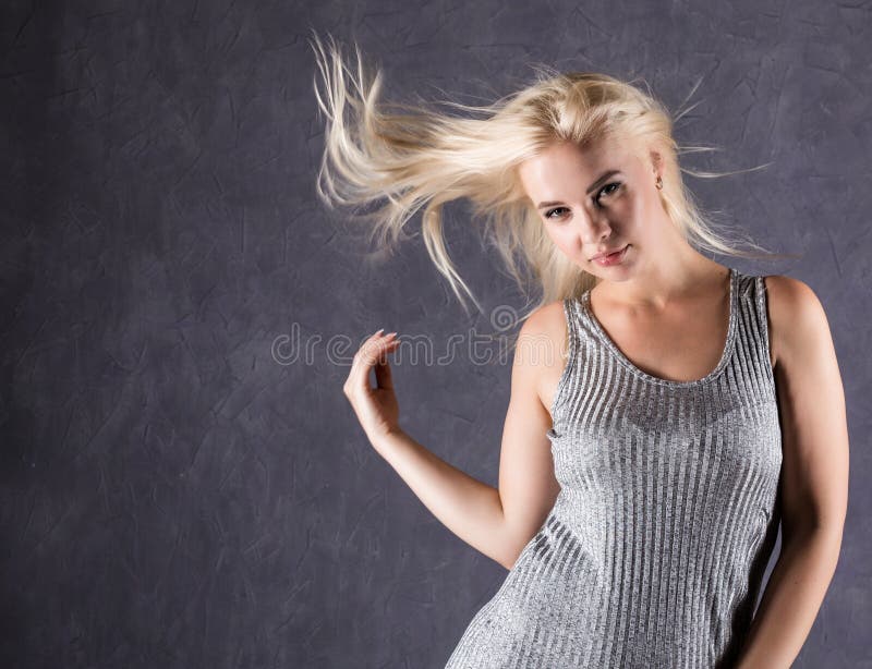 Blonde Woman With Hair In The Wind Girl With Flying Hair On A Gray