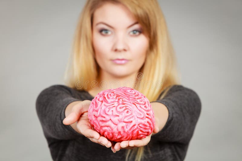 Woman Holding Brain Having Idea Stock Photo - Image of wondering, idea ...