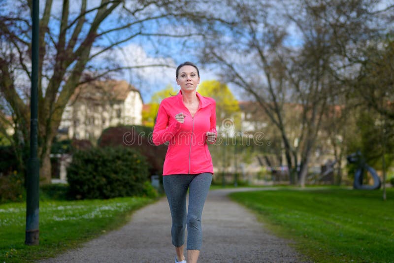 Blonde Woman Jogging in the Park Stock Image - Image of attractive ...