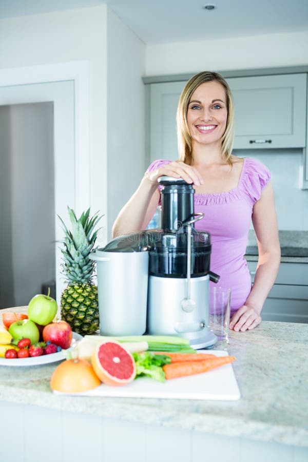 Blonde Woman Preparing a Smoothie in the Kitchen Stock Image - Image of ...