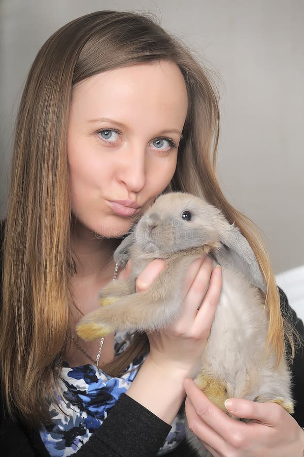 Blonde woman with a rabbit stock photo. Image of cheerful - 40209750