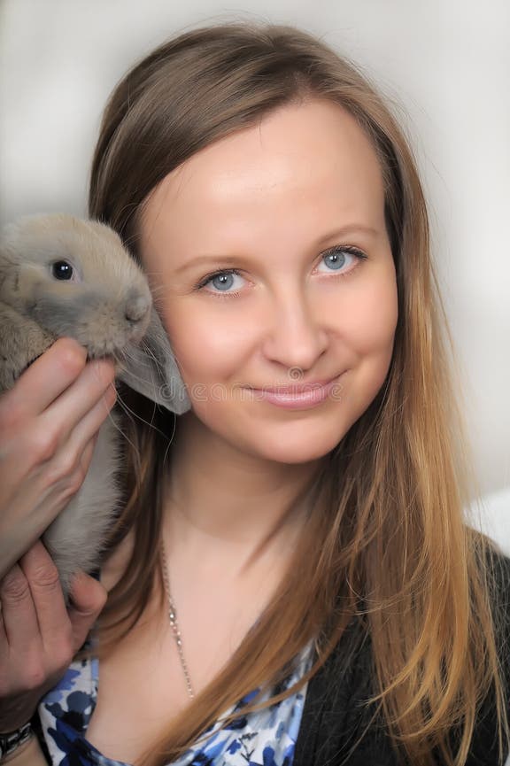 Blonde woman with a rabbit stock image. Image of face - 40209855