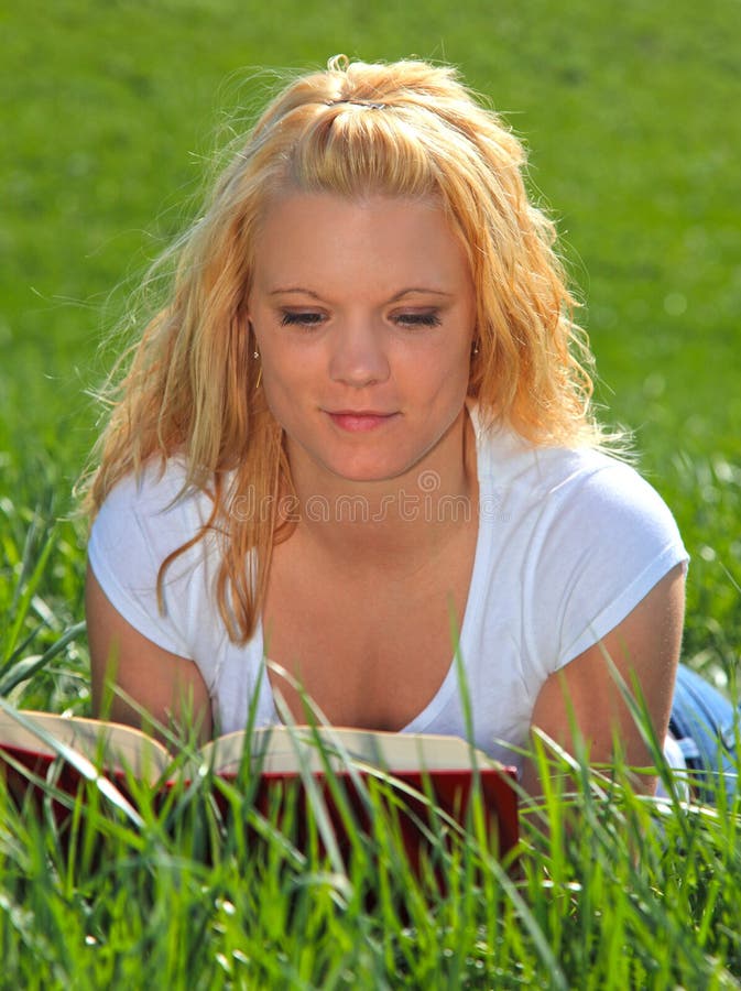 Blonde Woman Reading Book Outside Stock Image - Image of blonde, grass ...