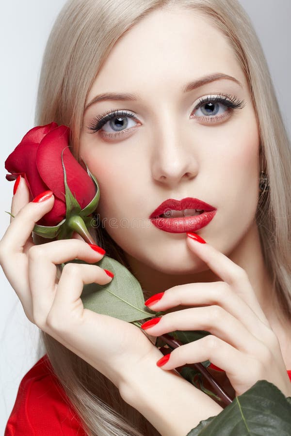 Young Woman with a Red Rose Stock Photo - Image of hairstyle, beautiful ...