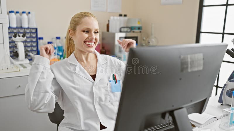 Blonde Woman Scientist Smiling while Working with Computer in ...