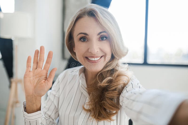 Blonde Woman Smiling And Waving Her Hand Stock Image Image Of