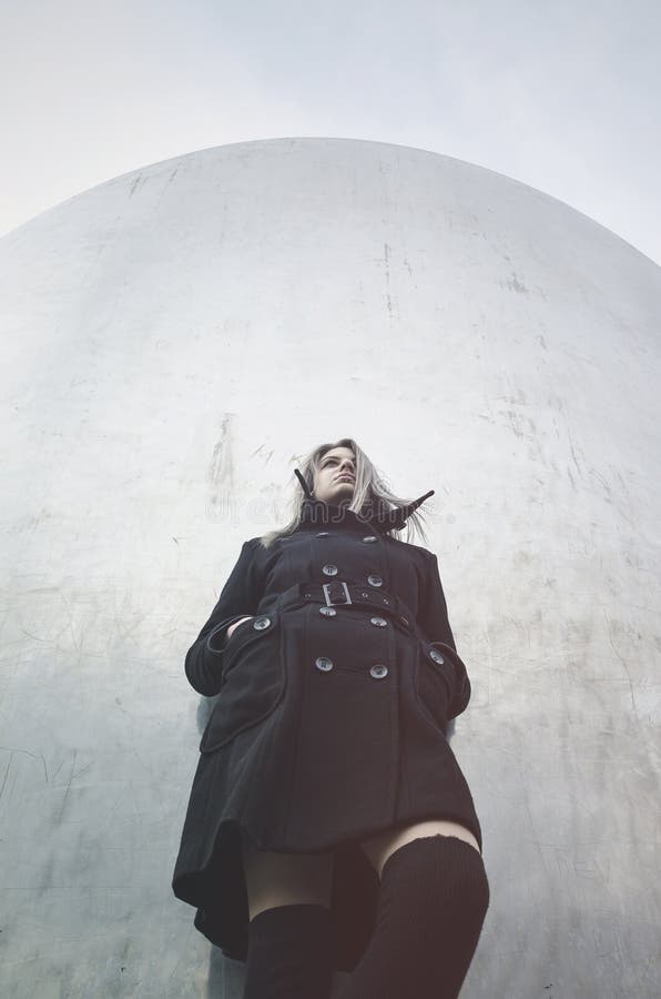 Blonde Young Girl on Curved Background in Provocative Pose Stock Photo ...