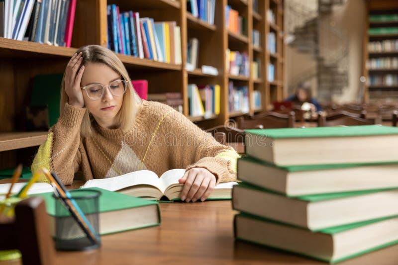 Blonde Young Woman Studying in the Library Stock Image - Image of ...