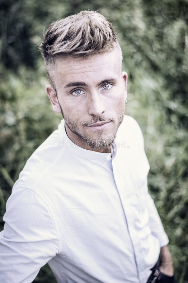 Blondish, Blue Eyed Young Man by River Smiling Stock Image - Image of ...