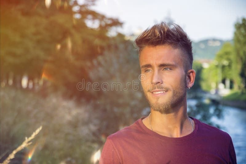 Blondish, Blue Eyed Young Man by River Smiling Stock Image - Image of ...