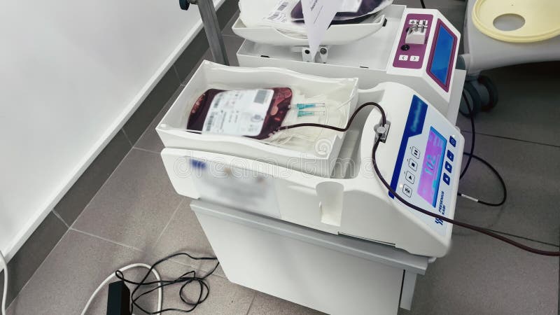 Blood Donation Process. Plastic Bag with Blood is on the Machine Moving ...