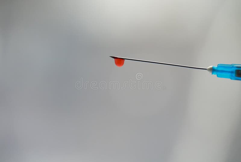 Blood Drop Hanging from the Tip of the Syringe Needle Stock Image ...