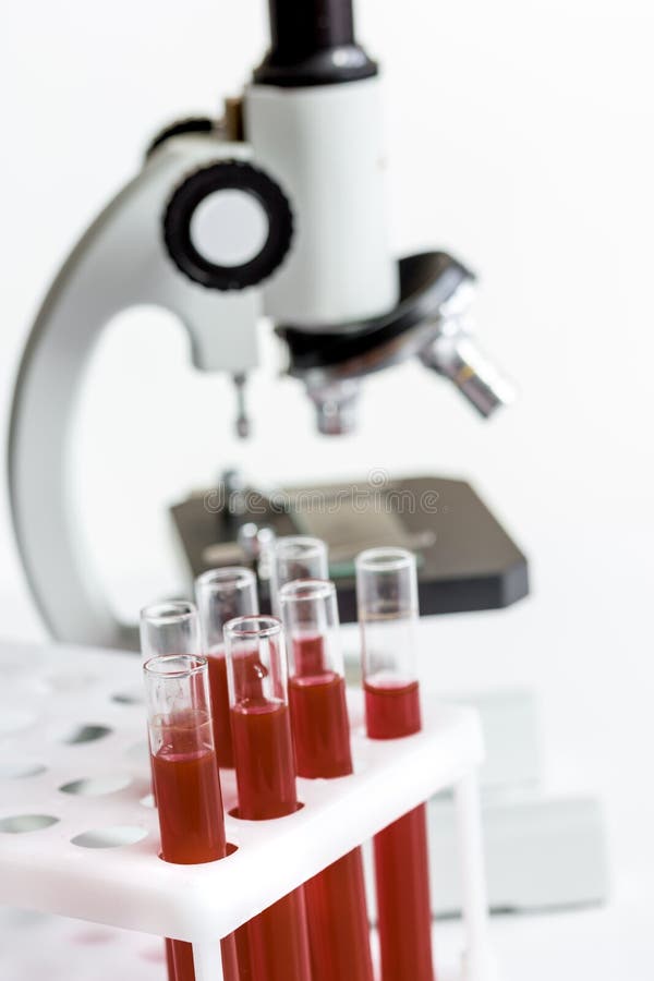Blood in Glass Tubes on Background of Microscope Stock Image - Image of ...