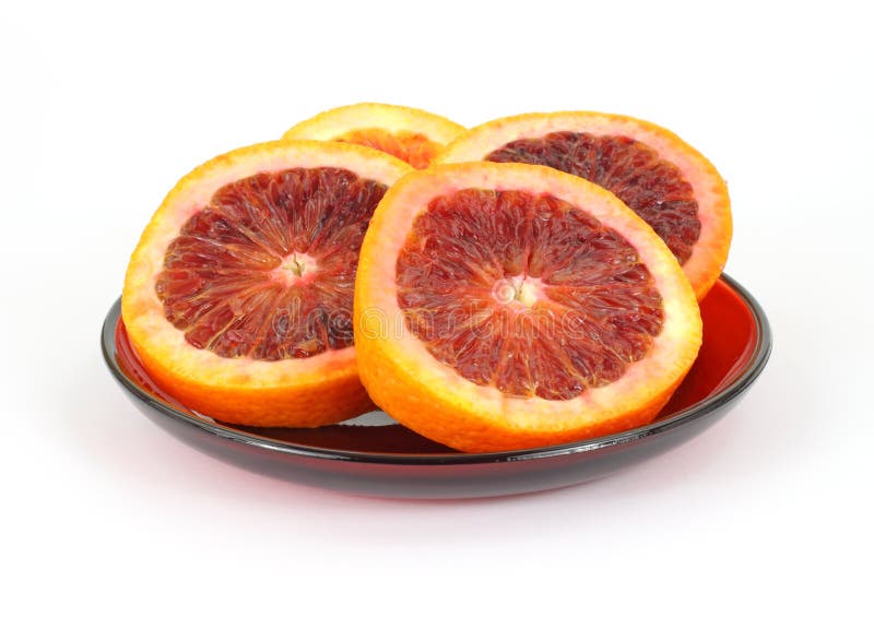 Blood Oranges on Red Plate stock image. Image of juicy - 13327875