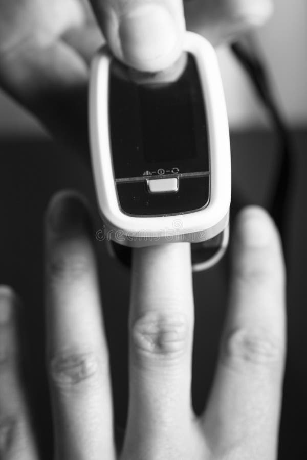 Blood oxygen finger meter stock photo. Image of disease - 180953224