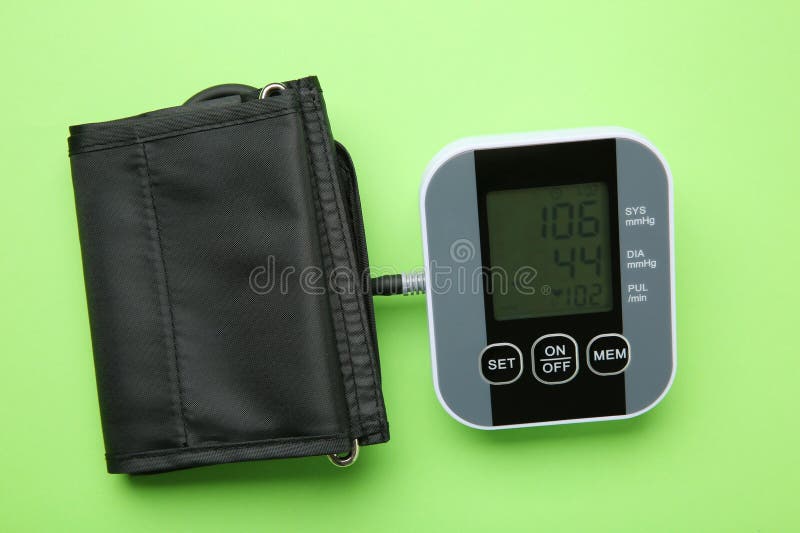 Blood Pressure Measuring Device on Green Background, Top View Stock ...