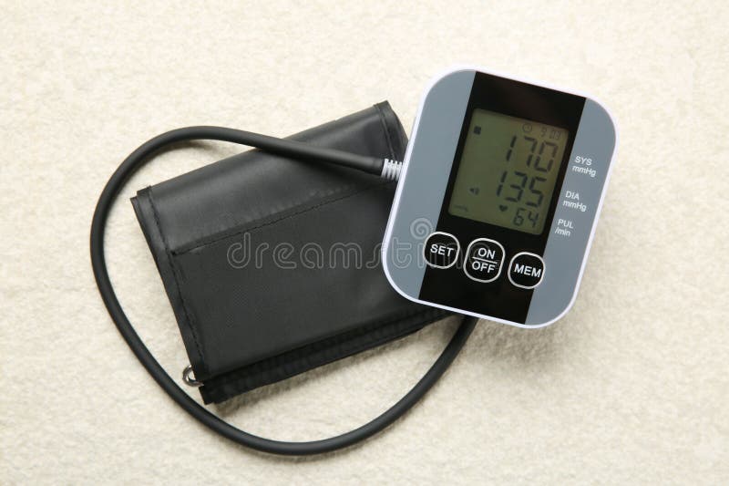 Blood Pressure Measuring Device on Light Textured Background, Top View ...