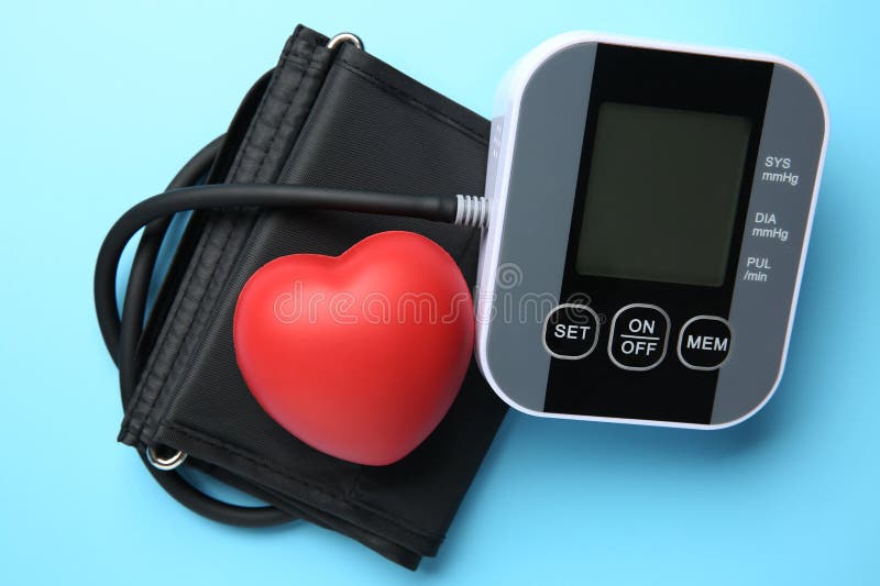 Blood Pressure Measuring Device and Squeeze Heart on Light Blue ...