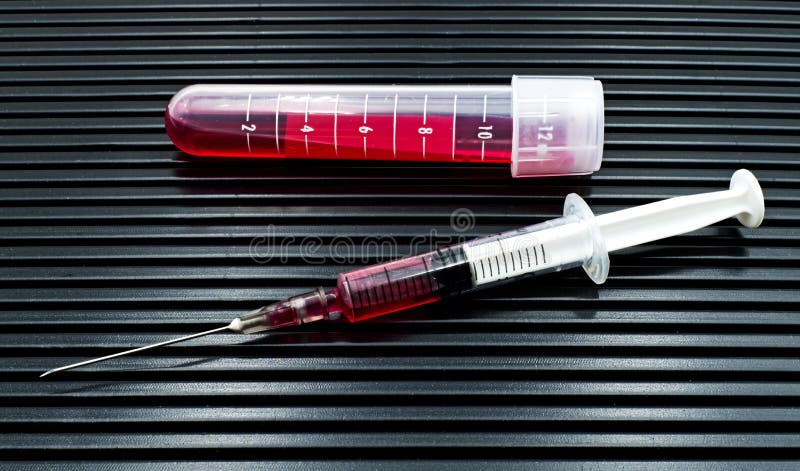 Blood Sample and Syringe Injection, Isolated on Dark Background Stock ...