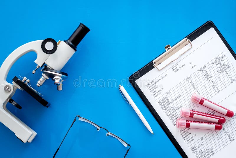 Blood Test Results Near Microscope on Blue Background Top View Stock ...