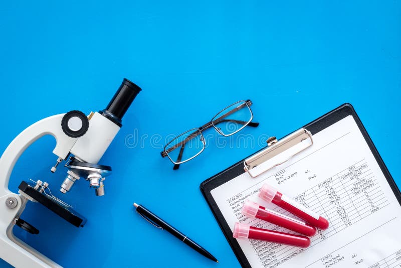 Blood Test Results Near Microscope on Blue Background Top View Copy ...