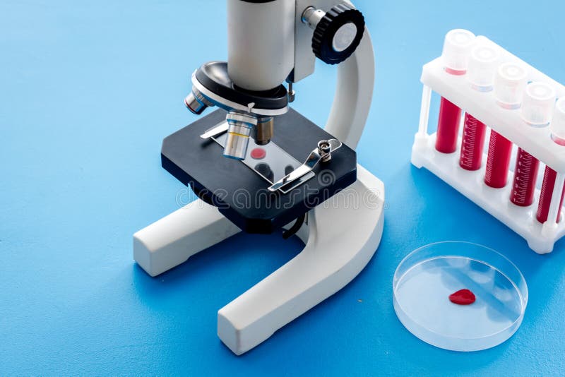 Blood Testing Laboratory. Samples Viewing Under Microscope Near Tubes ...