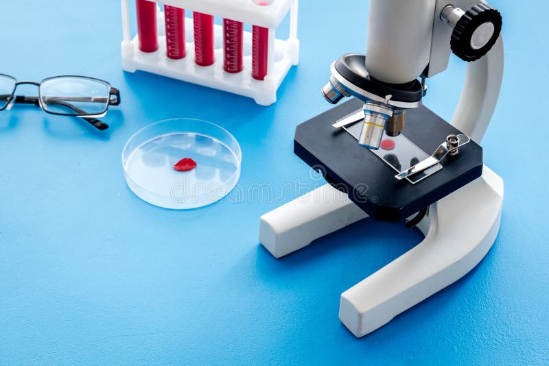 Blood Testing Laboratory. Samples Viewing Under Microscope Near Tubes ...