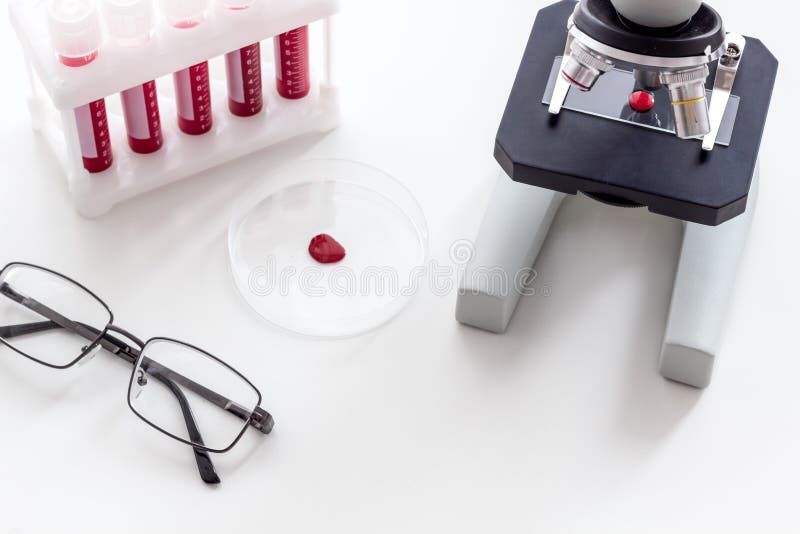 Blood Testing Laboratory. Samples Viewing Under Microscope Near Tubes ...