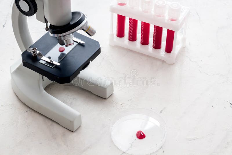 Blood Testing Laboratory. Samples Viewing Under Microscope Near Tubes ...