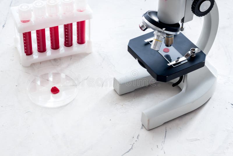 Blood Testing Laboratory. Samples Viewing Under Microscope Near Tubes ...