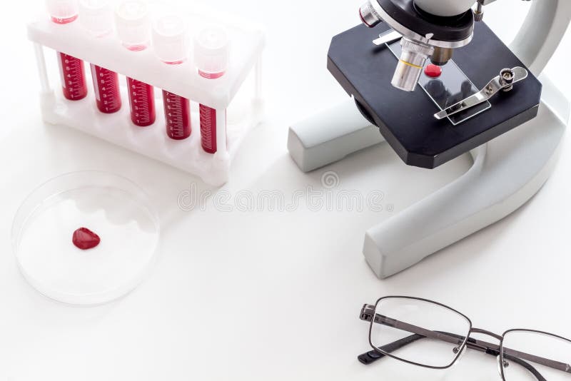 Blood Testing Laboratory. Samples Viewing Under Microscope Near Tubes ...