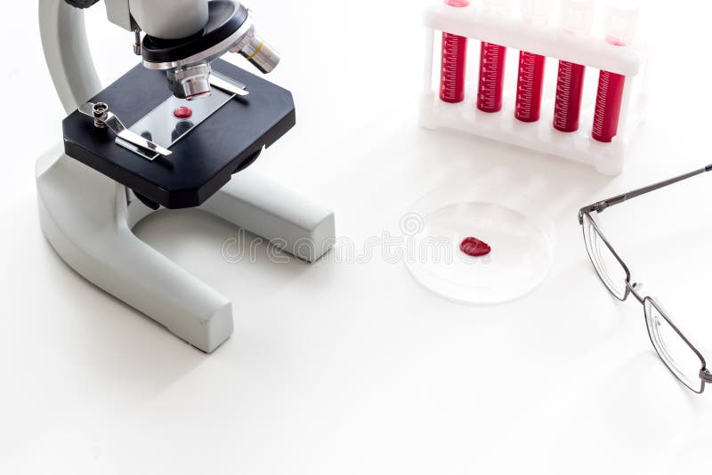Blood Testing Laboratory. Samples Viewing Under Microscope Near Tubes ...