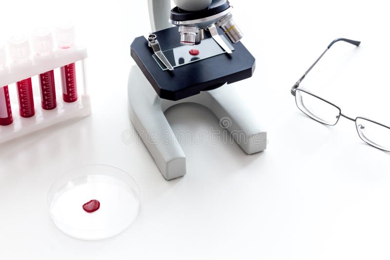 Blood Testing Laboratory. Samples Viewing Under Microscope Near Tubes ...