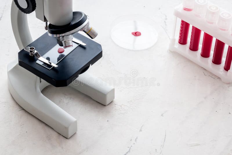 Blood Testing Laboratory. Samples Viewing Under Microscope Near Tubes ...