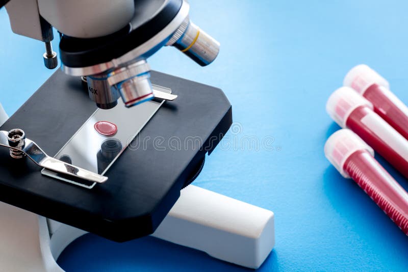 Blood Testing. Samples Viewing Undermicroscope on Blue Background Top ...