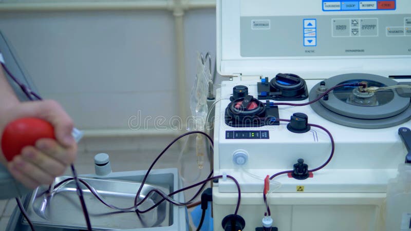Blood Transfusion Equipment Works on a Patient, Pumping Blood. Stock ...