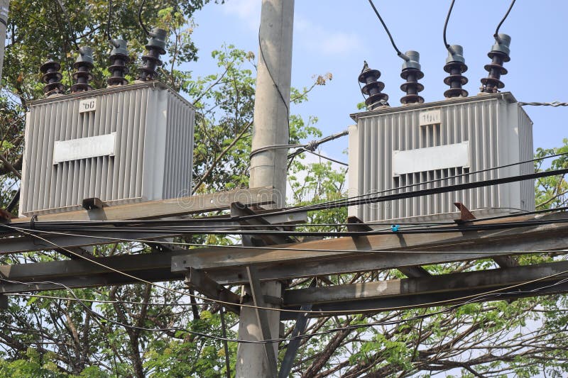 Electric Transformers Installed on Poles, Function As Regulators of ...