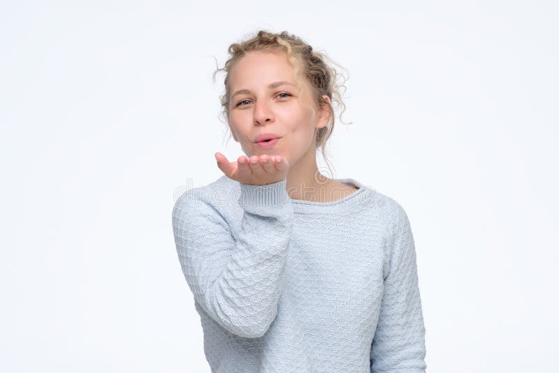 Curly Caucasian Girl Showing Zip Gesture As If Shutting Mouth On Key