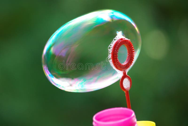 Blowing Bubbles stock image. Image of hover, clear, wrap - 6474997
