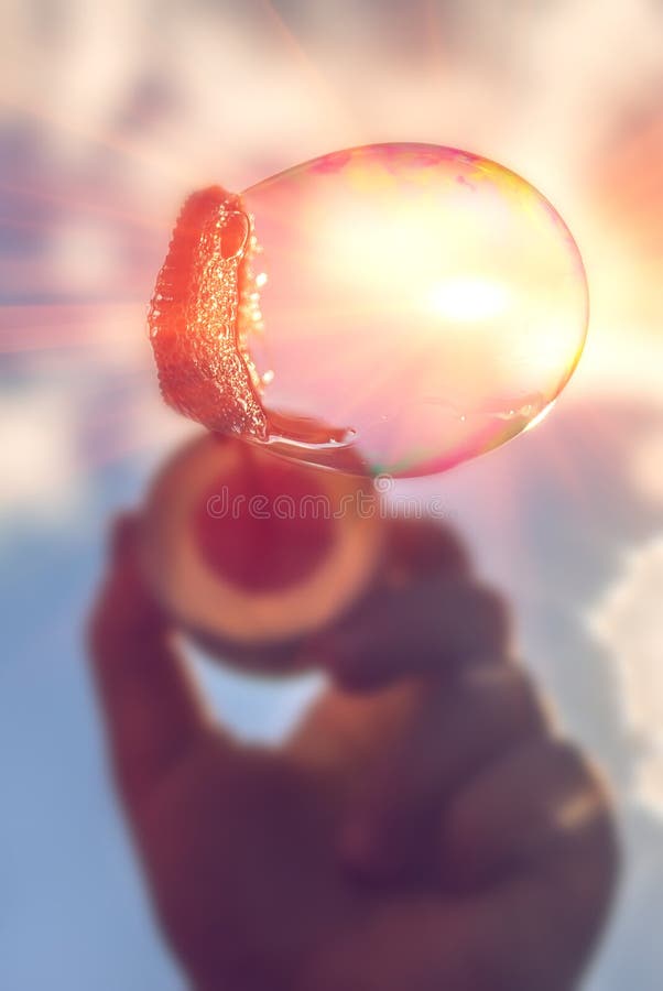 Blowing bubbles at sunset. stock photo. Image of aqua - 77981982