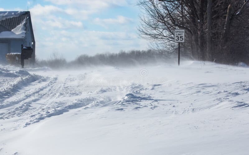 Blowing, Drifting Snow Across a Country Road Stock Photo - Image of ...