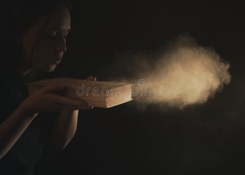 Blowing dust off Bible stock image. Image of woman, text - 36962807