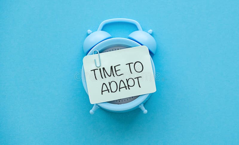 Blu Alarm Clock with Text Time To Adapt on Blue Background Stock Image ...