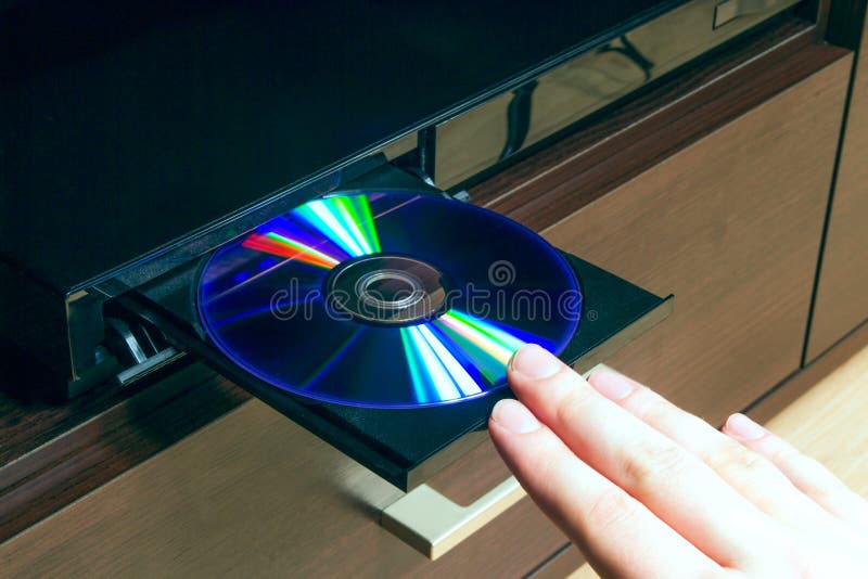 Blu-ray or DVD player stock photo. Image of hand, inserting - 30302276