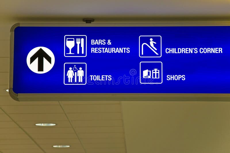 Blue Airport Direction Sign Stock Image - Image of chair, board: 17157601