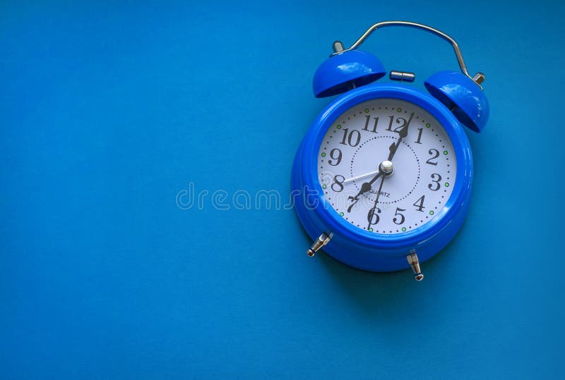 Blue alarm clock on blue stock photo. Image of time - 263613004