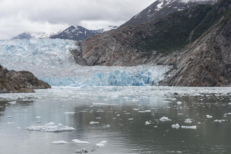 Blue Alaskan Glacier with Mountains Stock Photo - Image of large ...